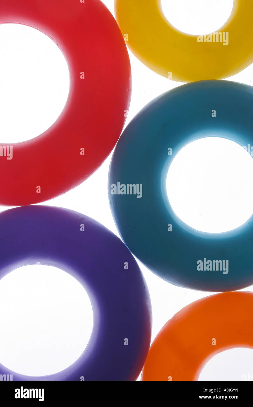 Plastic coloured rings back-lit with a white background Stock Photo - Alamy