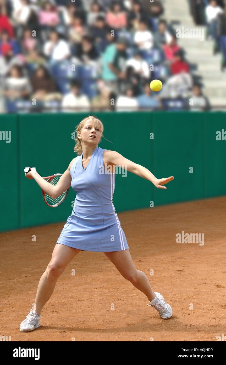 Female Tennis Player Hitting Ball Stock Photo - Alamy