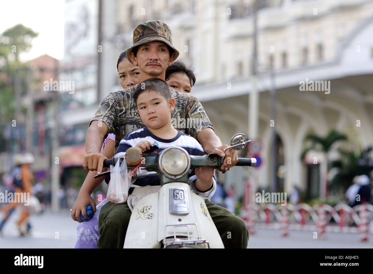 Vietnam four people on motorbike hi-res stock photography and images ...