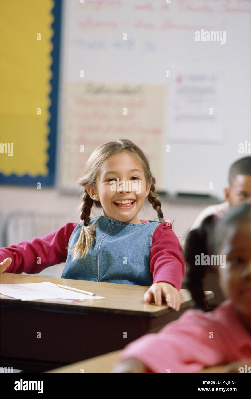 Portrait of a girl smiling in class Stock Photo - Alamy