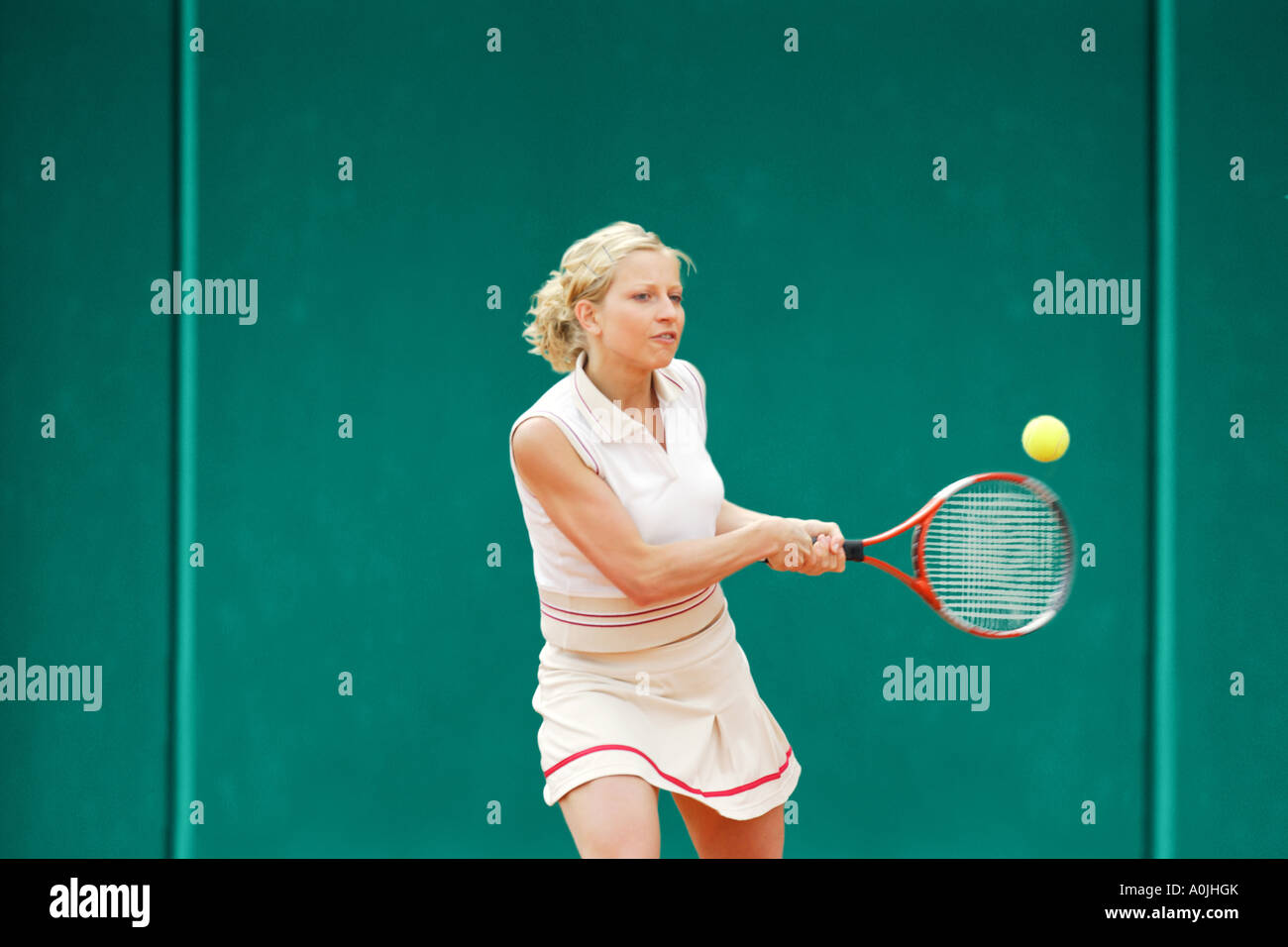 Female tennis player smashing the ball hi-res stock photography and ...