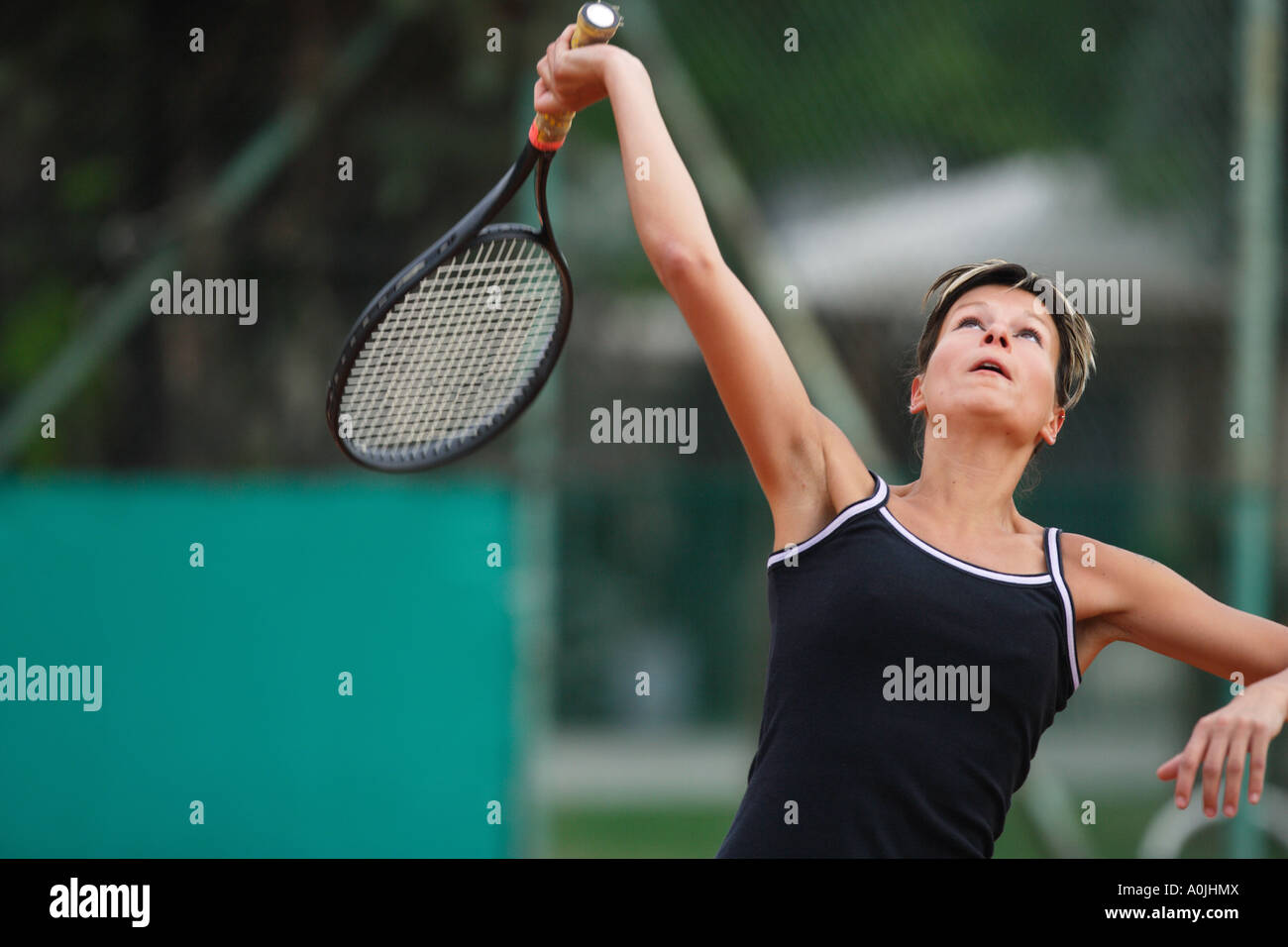Female Tennis Player Swinging Racquet Racket Stock Photo - Alamy