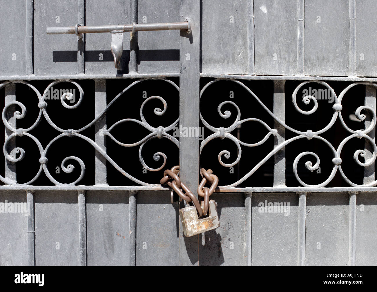 Double wrought iron gates with padlock in Alicante old town Spain Stock ...