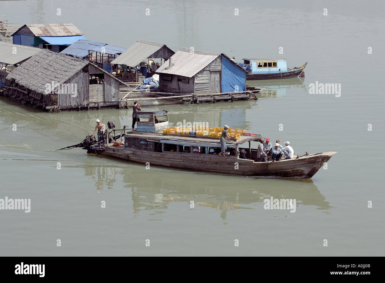 A boat in a floating village in Vietnam Stock Photo - Alamy