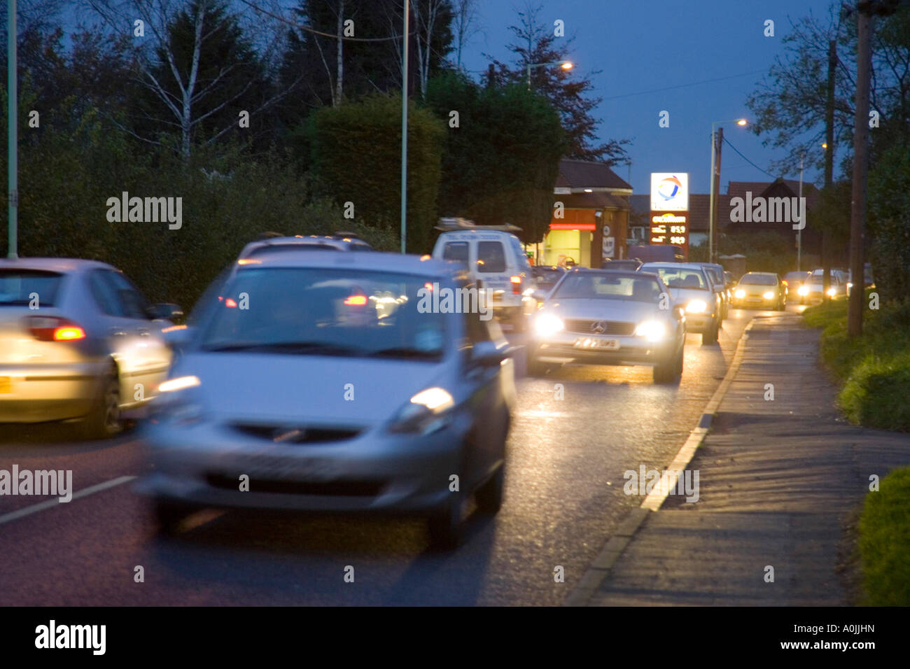 fast moving rush hour traffic through a village Stock Photo - Alamy