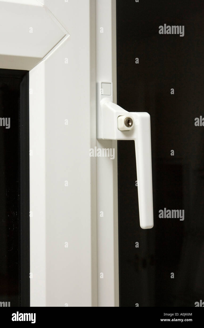 lockable security handle fitted on double glazed window Stock Photo - Alamy