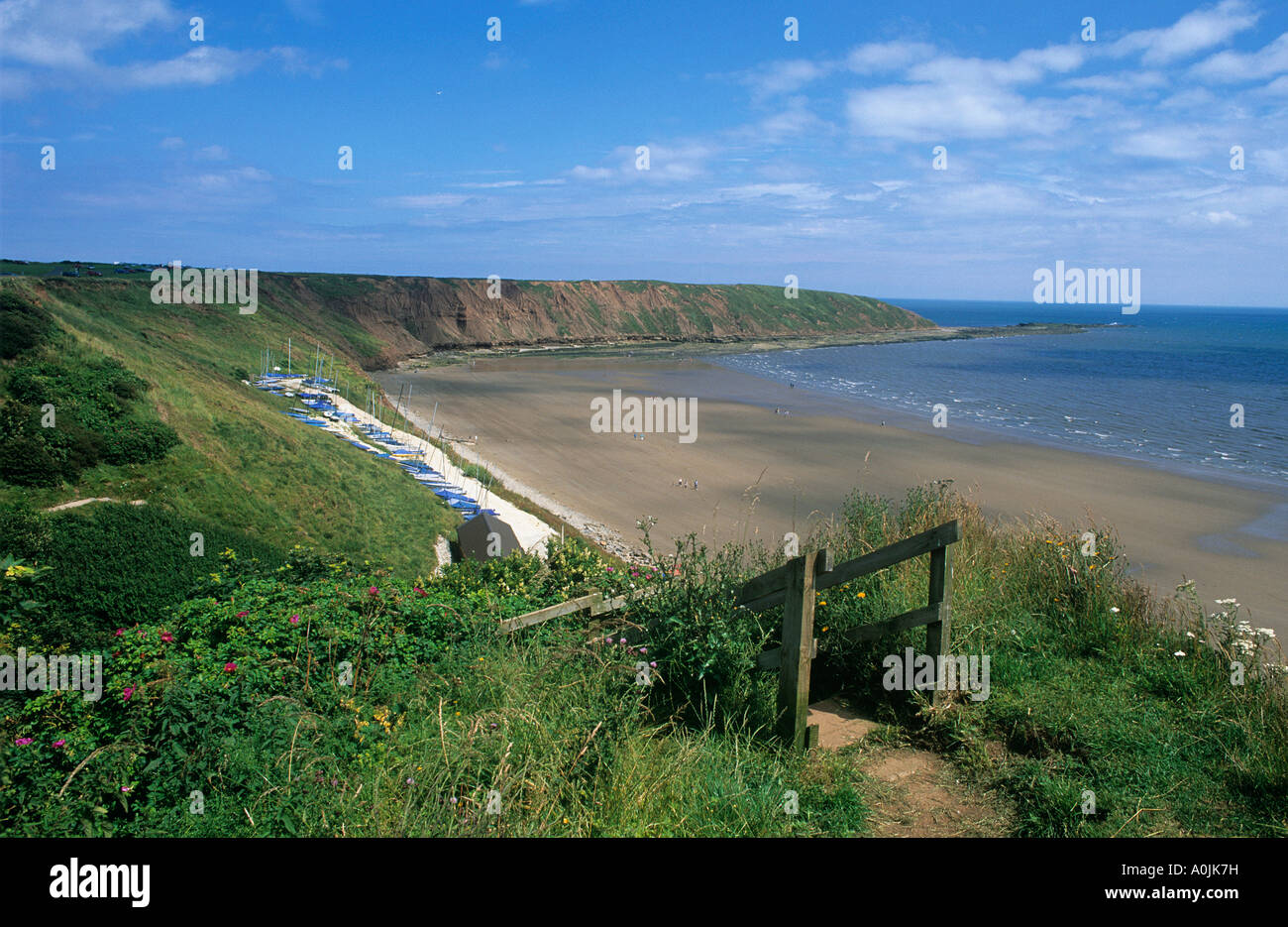 Looking down over people on the sandy beach at Filey Brigg Stock Photo ...