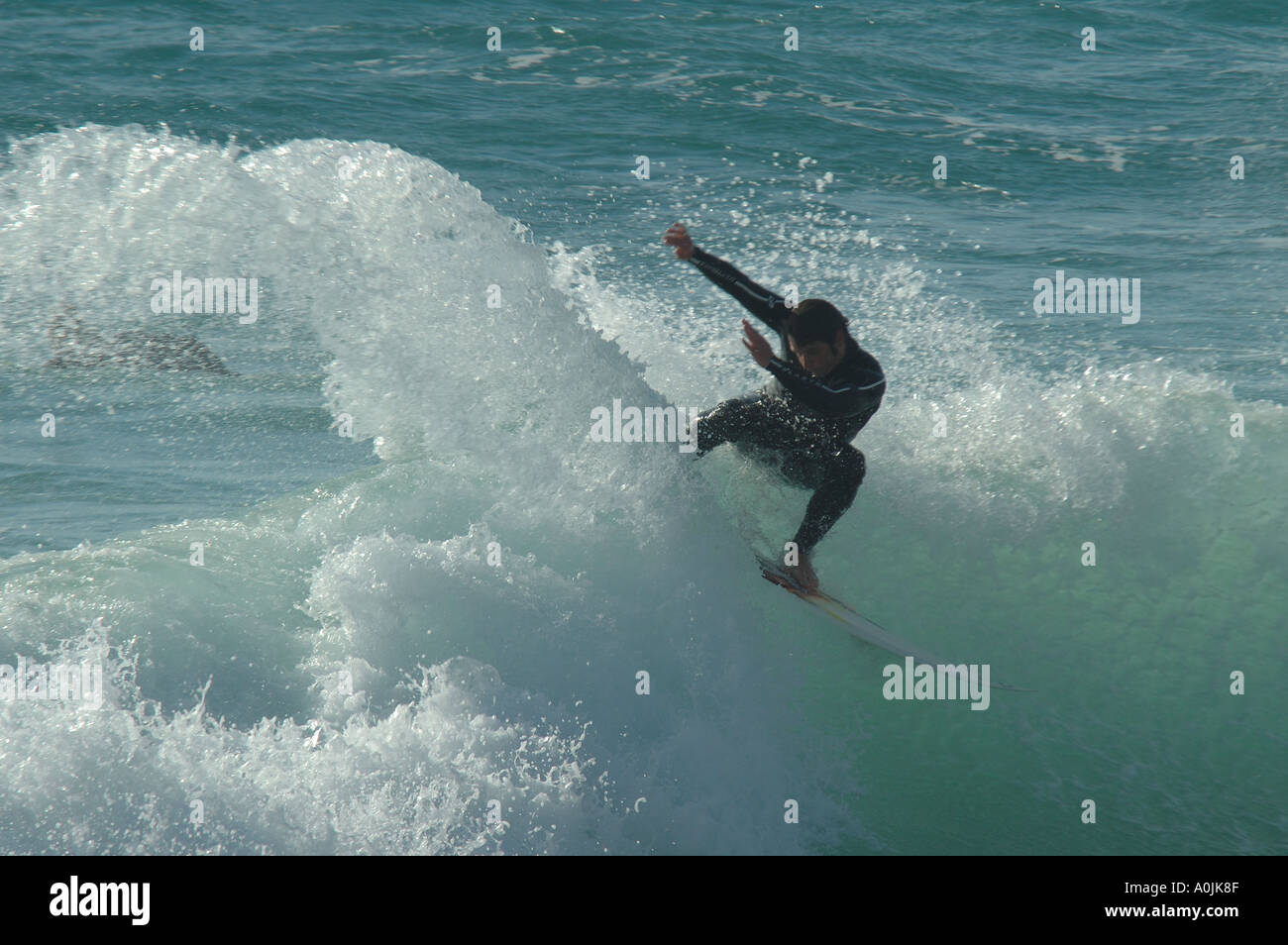Surfer Throwing Spray Stock Photo - Alamy