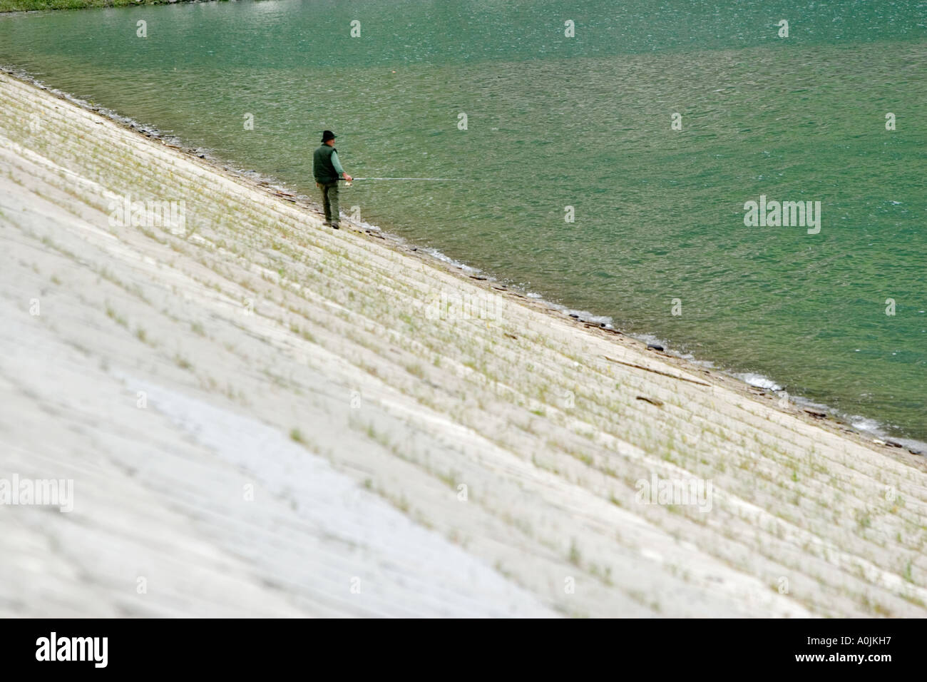 Fishing from the dam wall of Lake Resia also known as Reschensee South ...