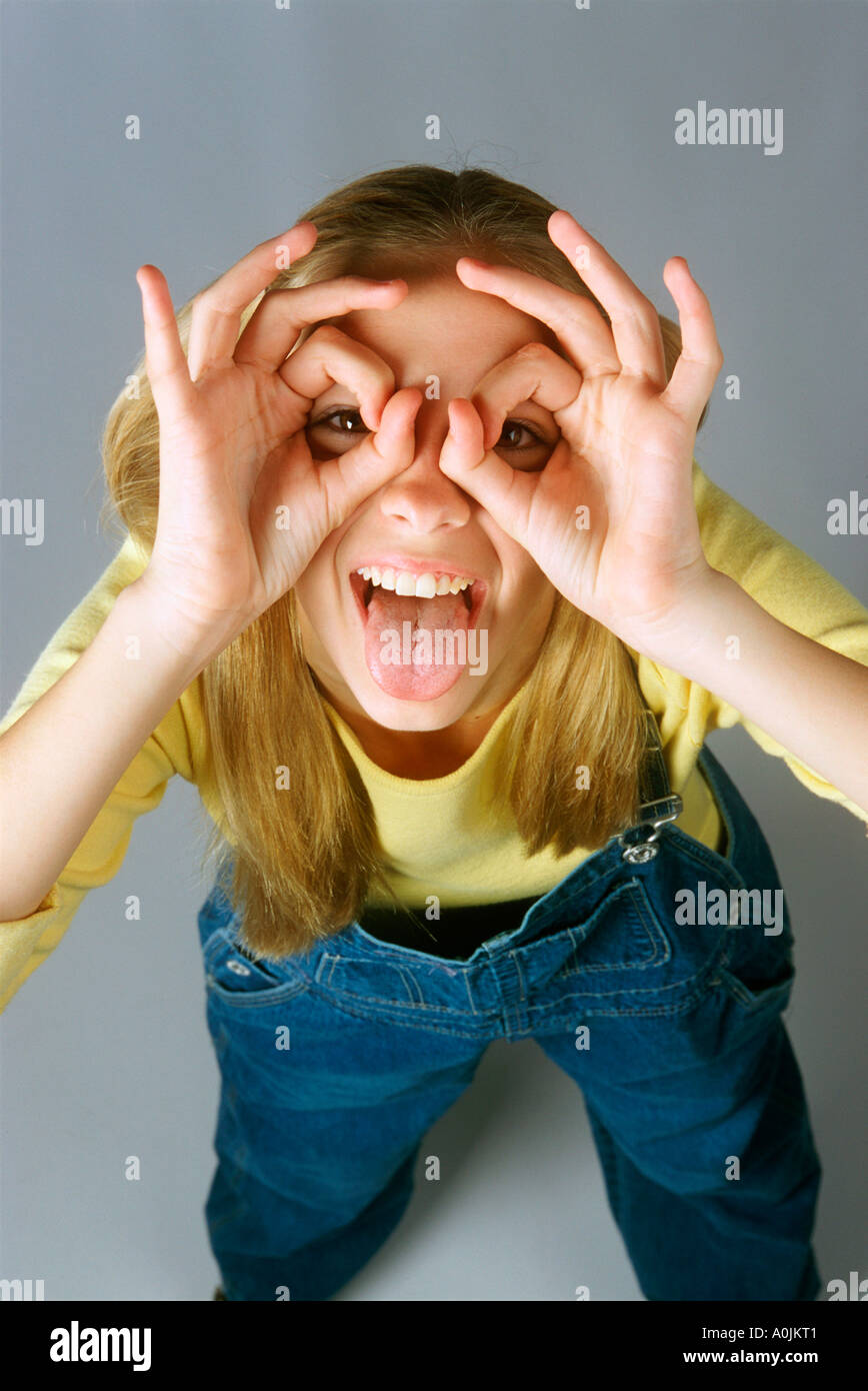 Portrait of a teenage girl making a face Stock Photo - Alamy