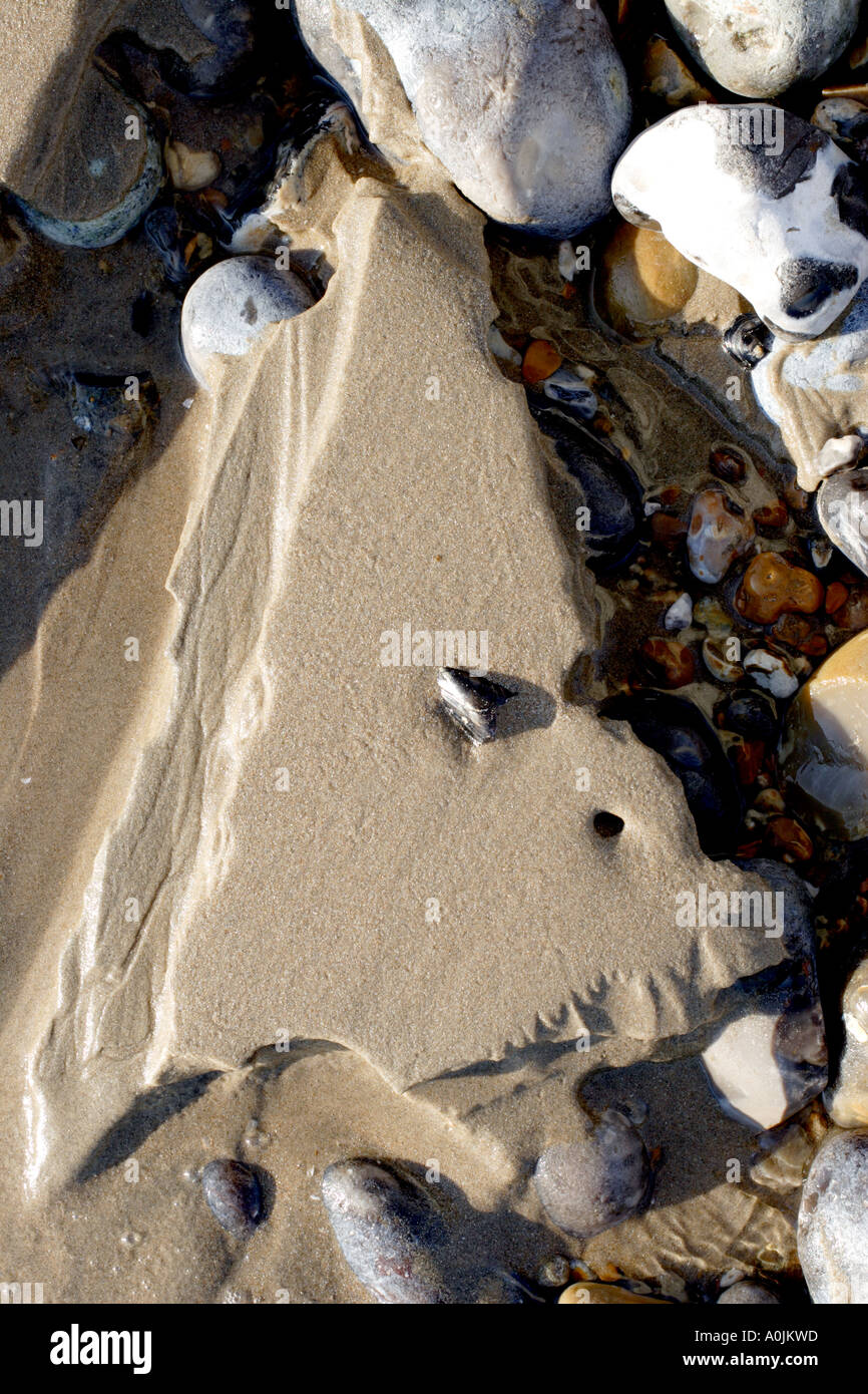 Sand and pebbles on beach Stock Photo - Alamy