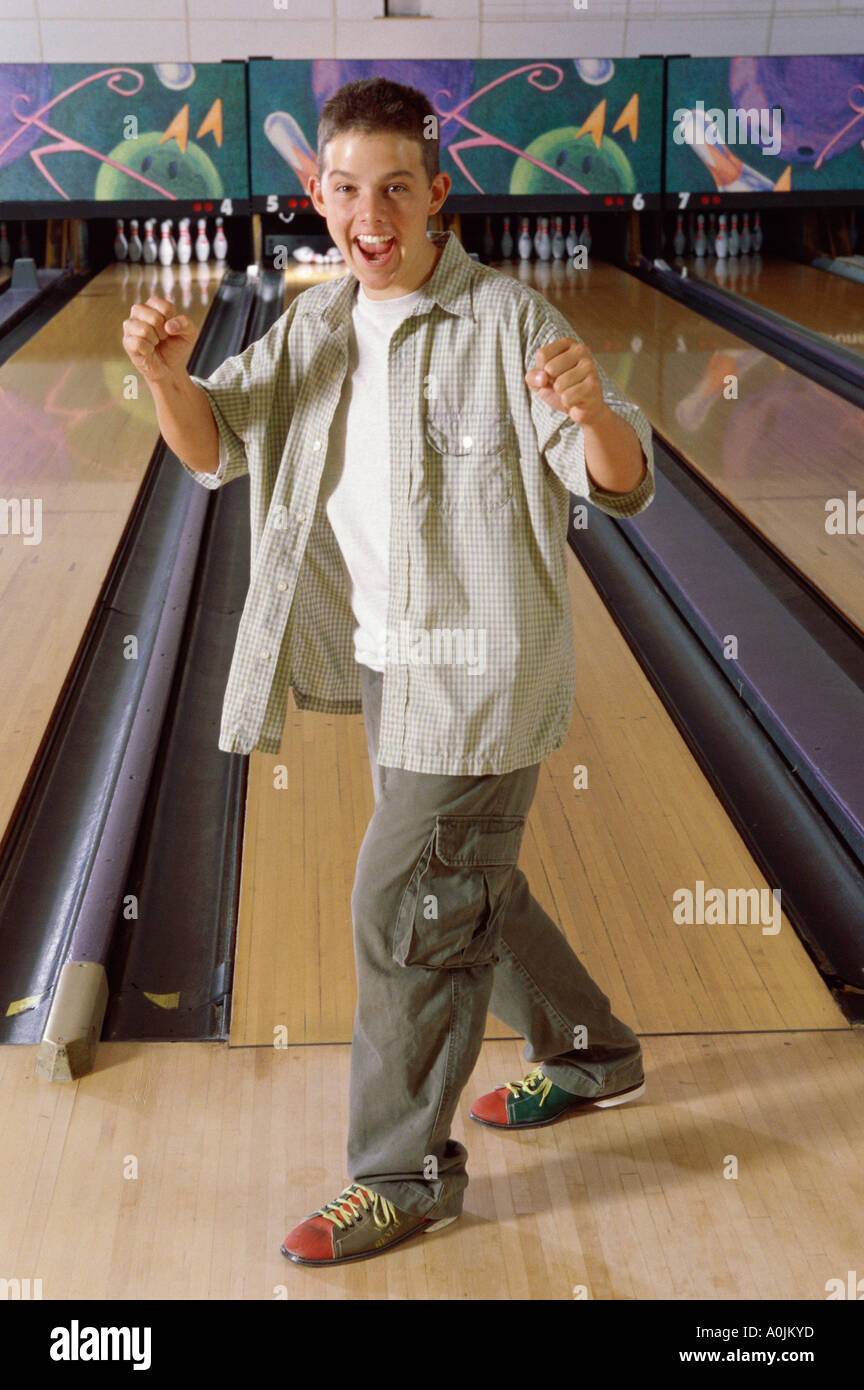 Portrait of a teenage boy in a bowling alley Stock Photo - Alamy