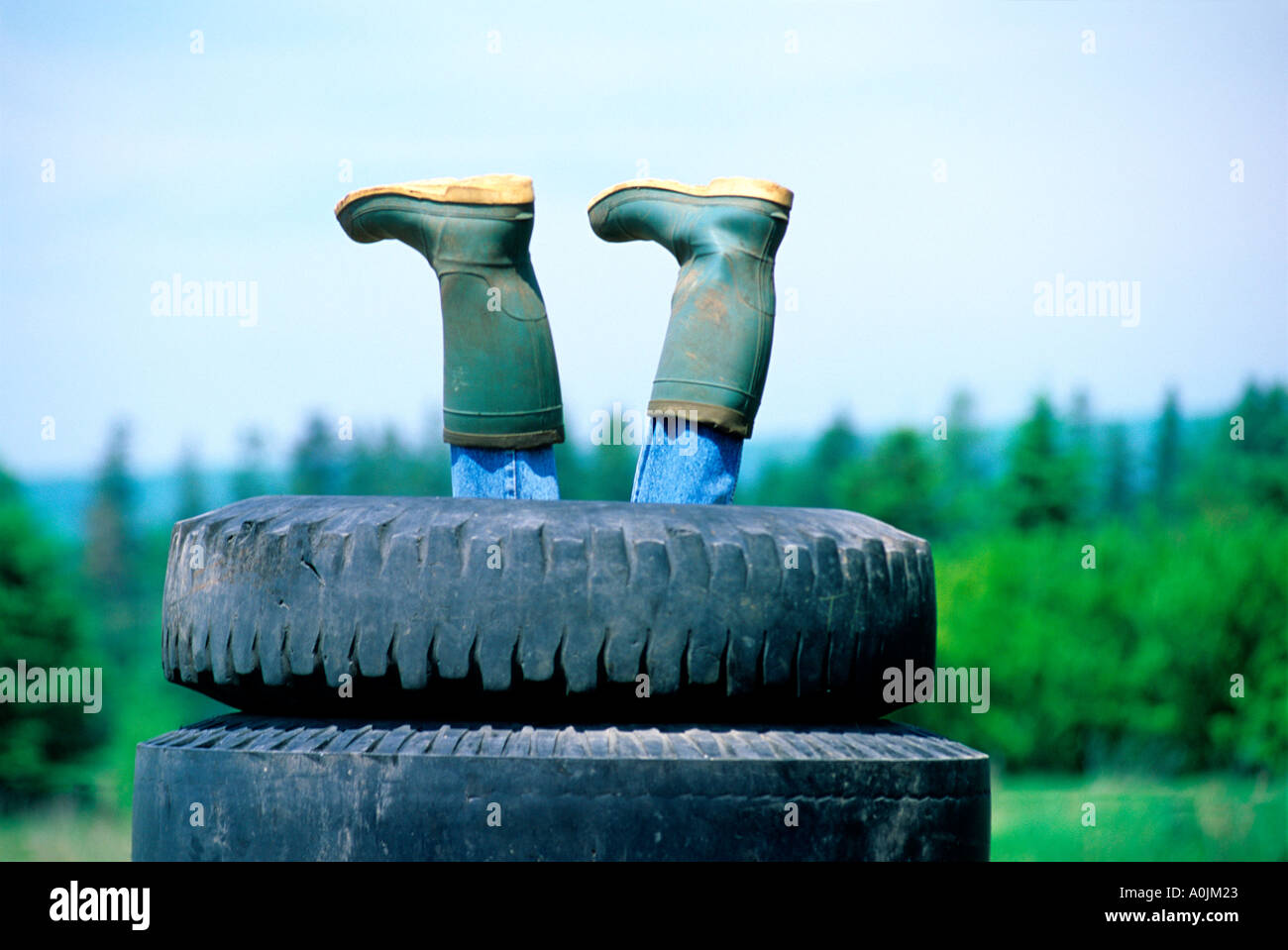 Boots in a tire 1 Stock Photo - Alamy