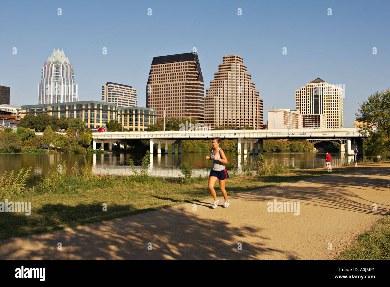 TEXAS Austin Female runner on multiuse path along Town Lake Colorado ...