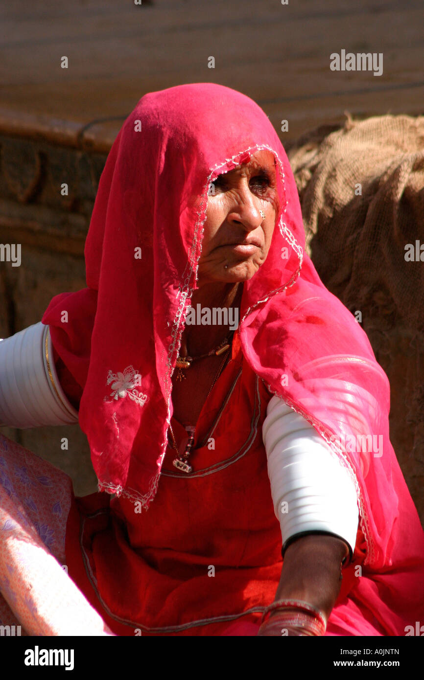 Rajasthani woman resting on a street corner in Jaisalmer, Rajasthan ...