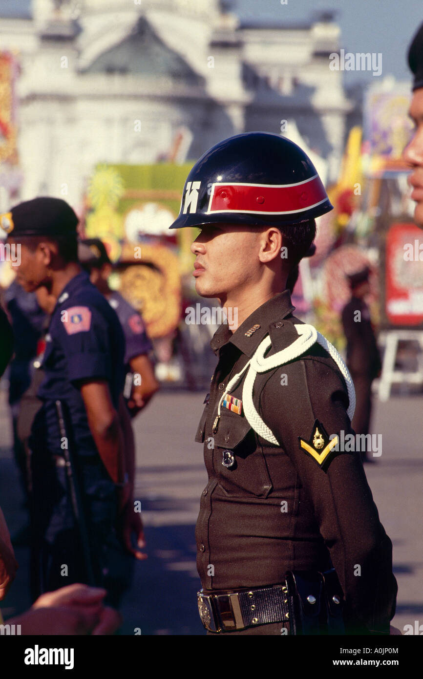 A policeman on a street in Thailand Stock Photo - Alamy