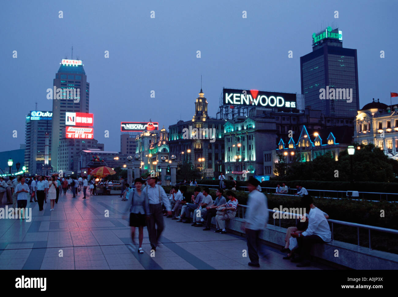 Chinese people walking strolling along The Bund in Waitan in the ...
