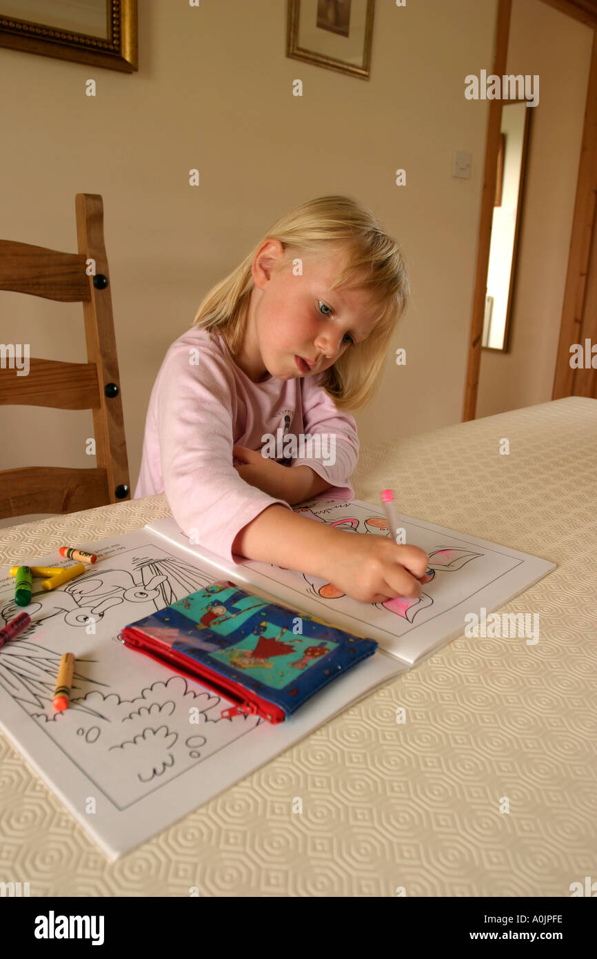 Child colouring with pens and crayons Girl aged 5 Stock Photo - Alamy