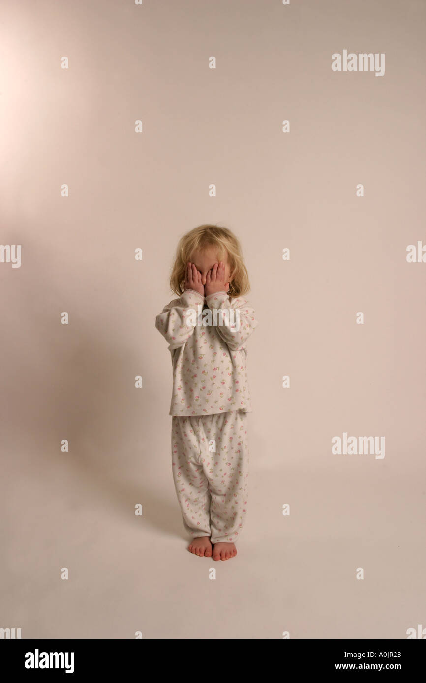 Toddler playing peebo Stock Photo - Alamy