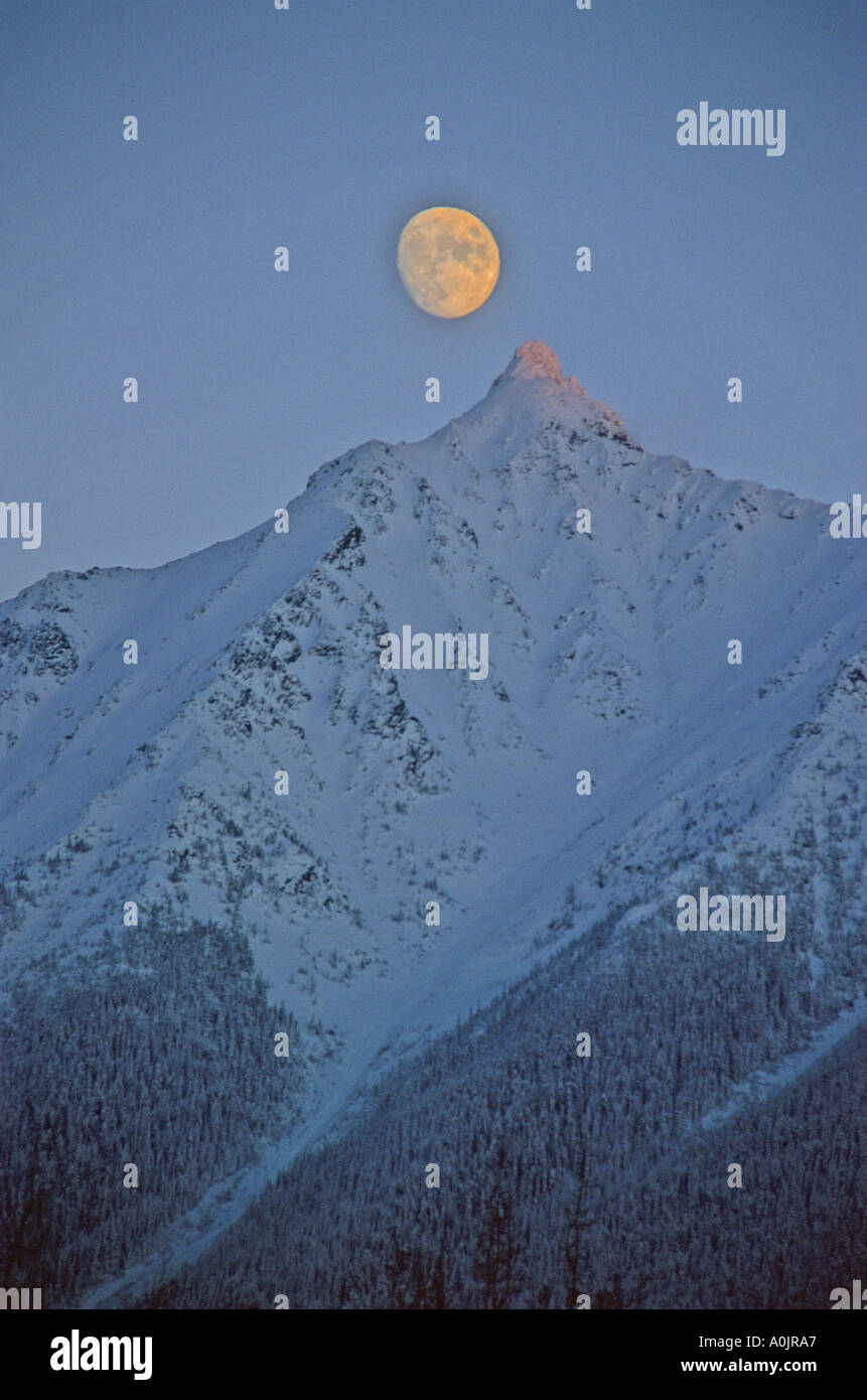 Full moon over snow capped hi-res stock photography and images - Alamy