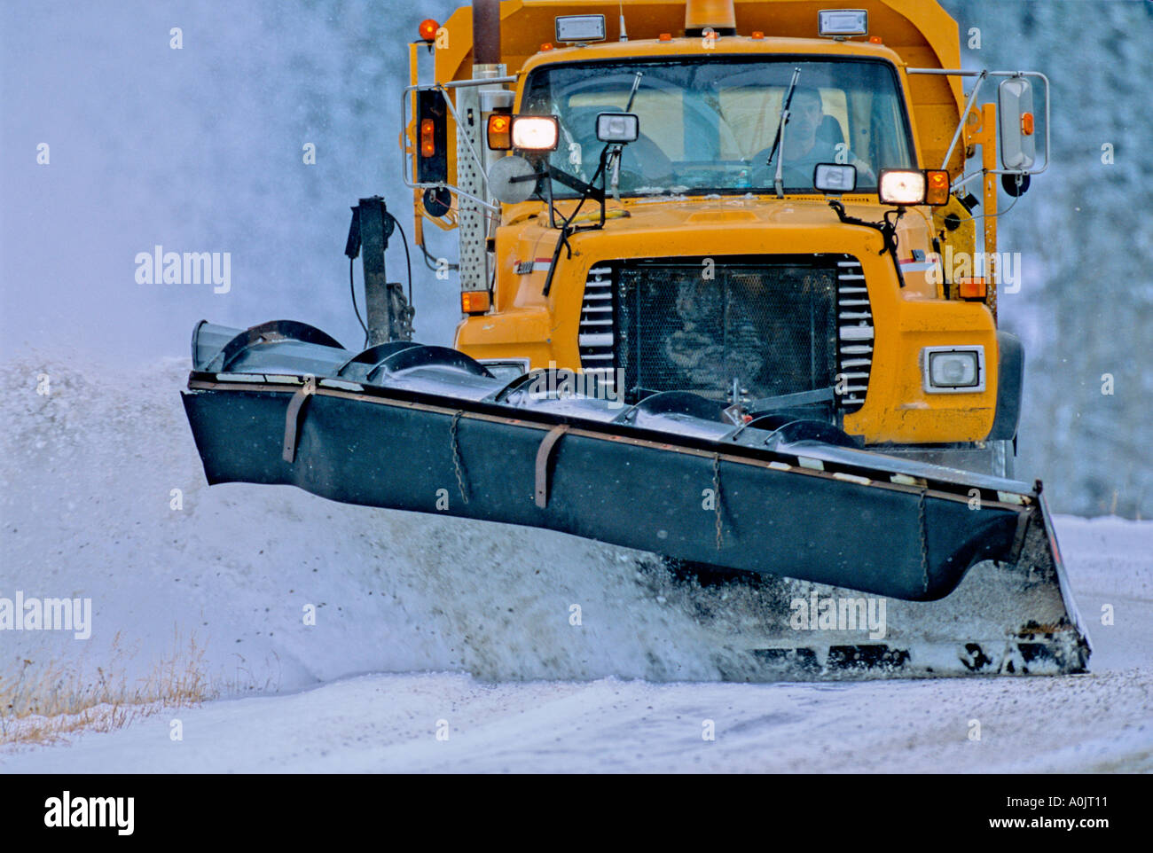 Truck plowing snow Stock Photo - Alamy