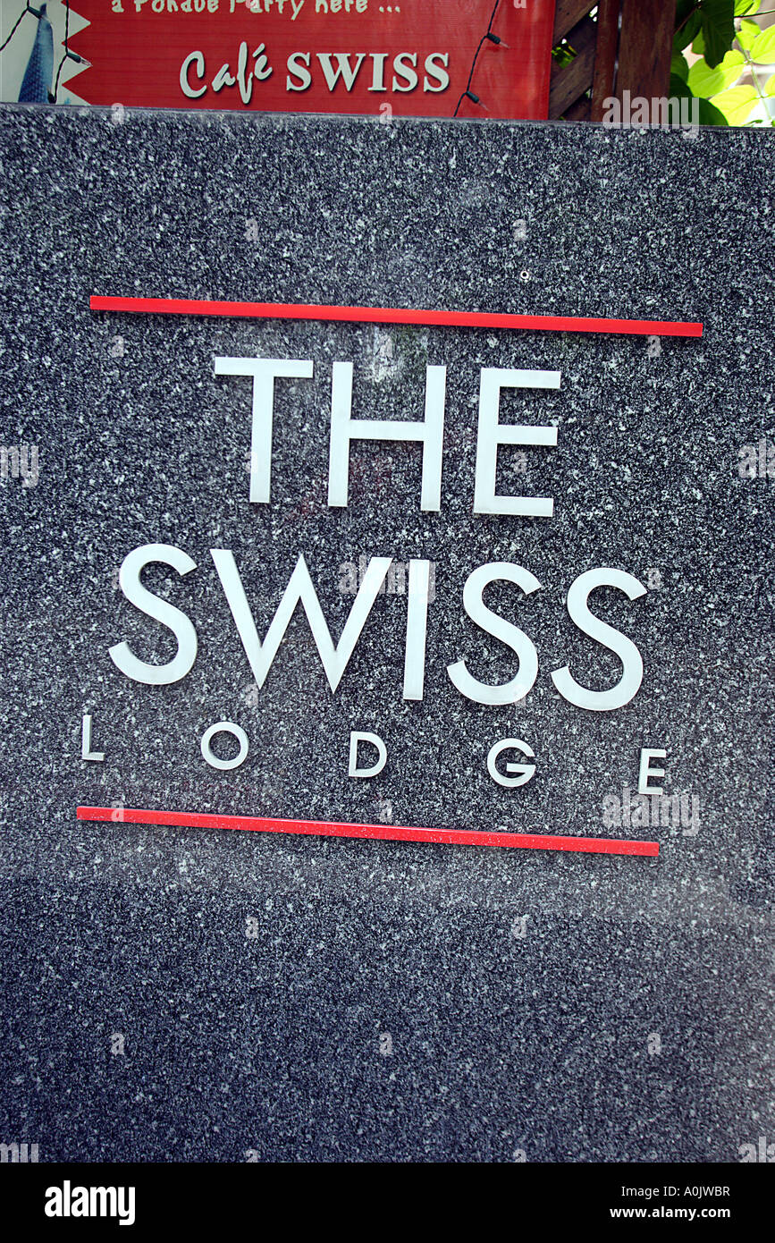 A sign for the Swiss Lodge Hotel in Bangkok Thailand Stock Photo - Alamy