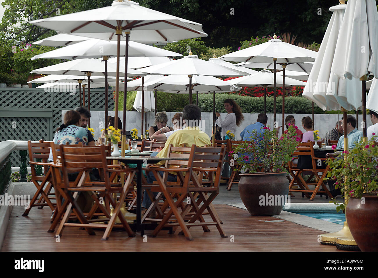 People sitting on the terrace of the Oriental Hotel in Bangkok Thailand ...