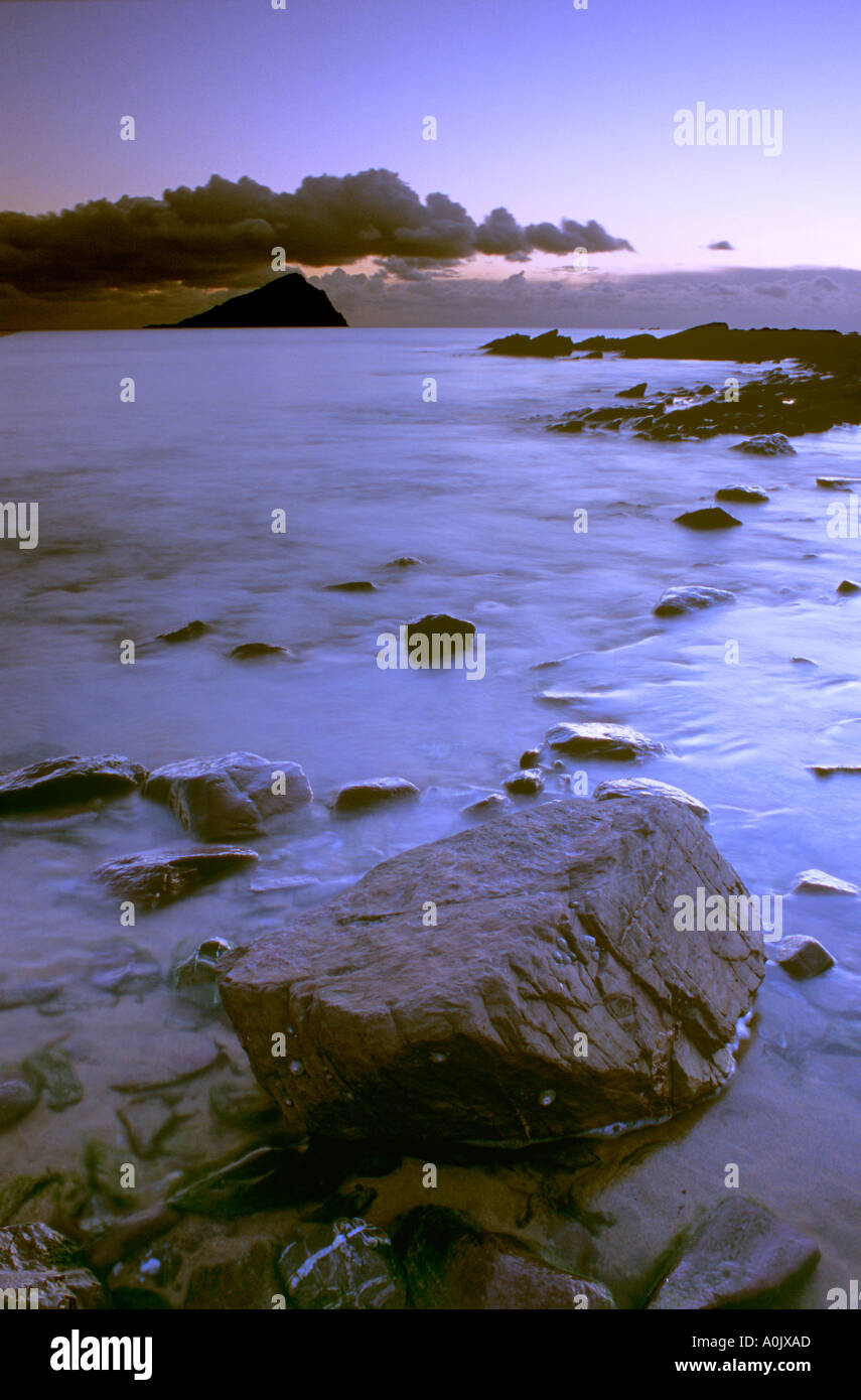 Wembury Beach and Great Mewstone South Devon at sunset with rocks and ...