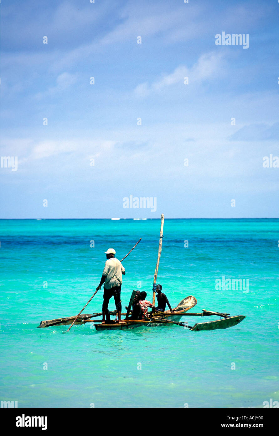 Zanzibaris sailing with a boat in the Indian ocean Kiwengwa beach ...