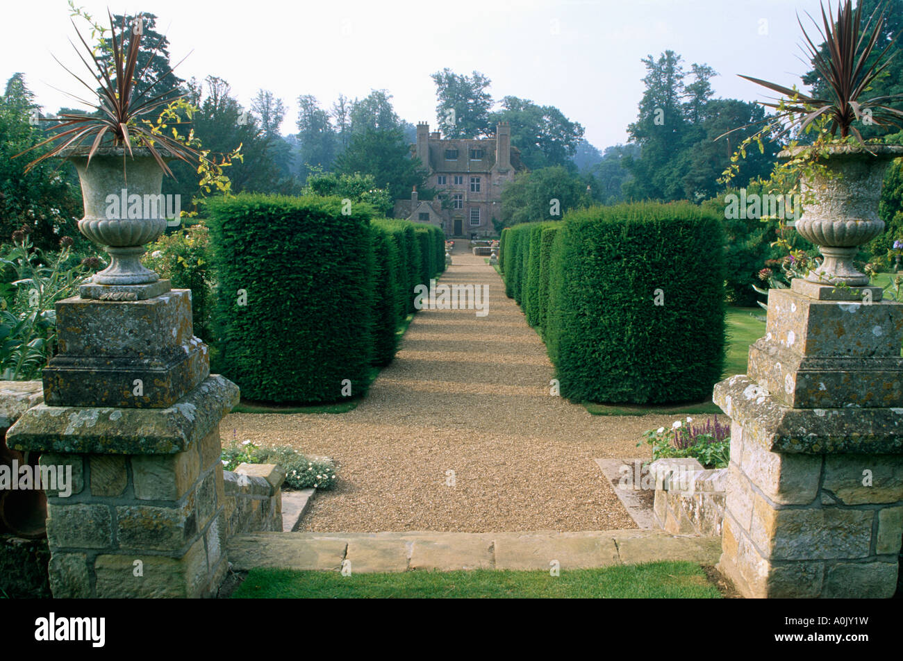 Large gravel path between formal clipped hedge Stock Photo - Alamy