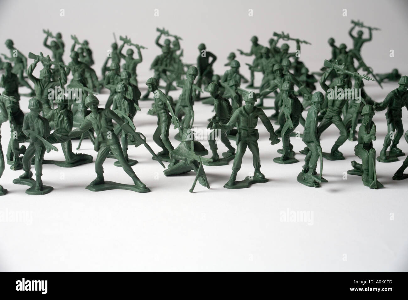 close up colour image off lots off green toy soldiers standing upright ...