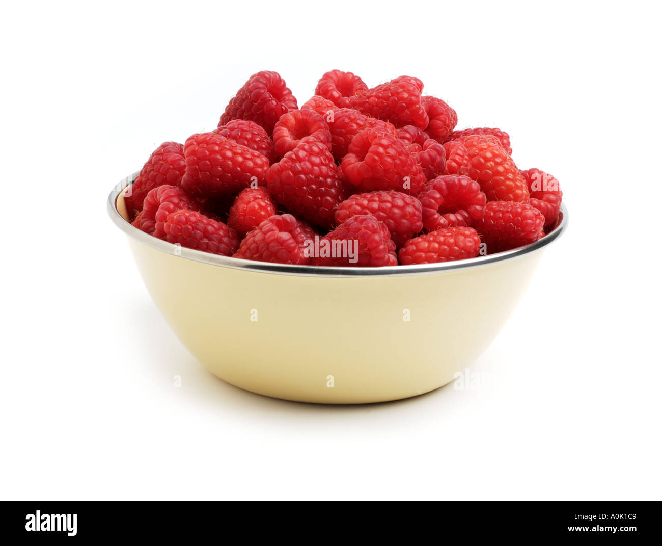 enamel bowl full of fresh red raspberries Stock Photo - Alamy