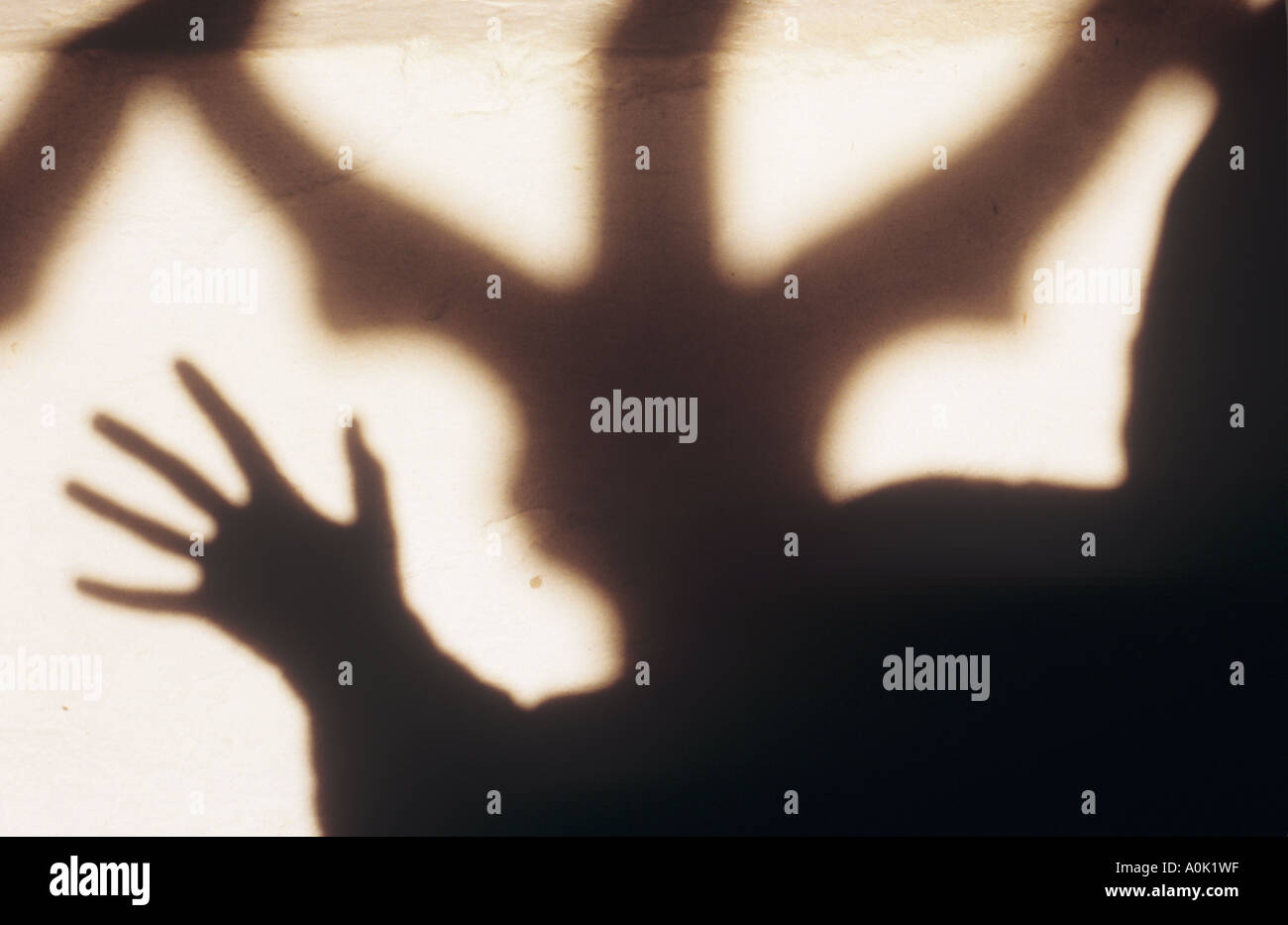 Ominous silhouette of a hand hi-res stock photography and images - Alamy