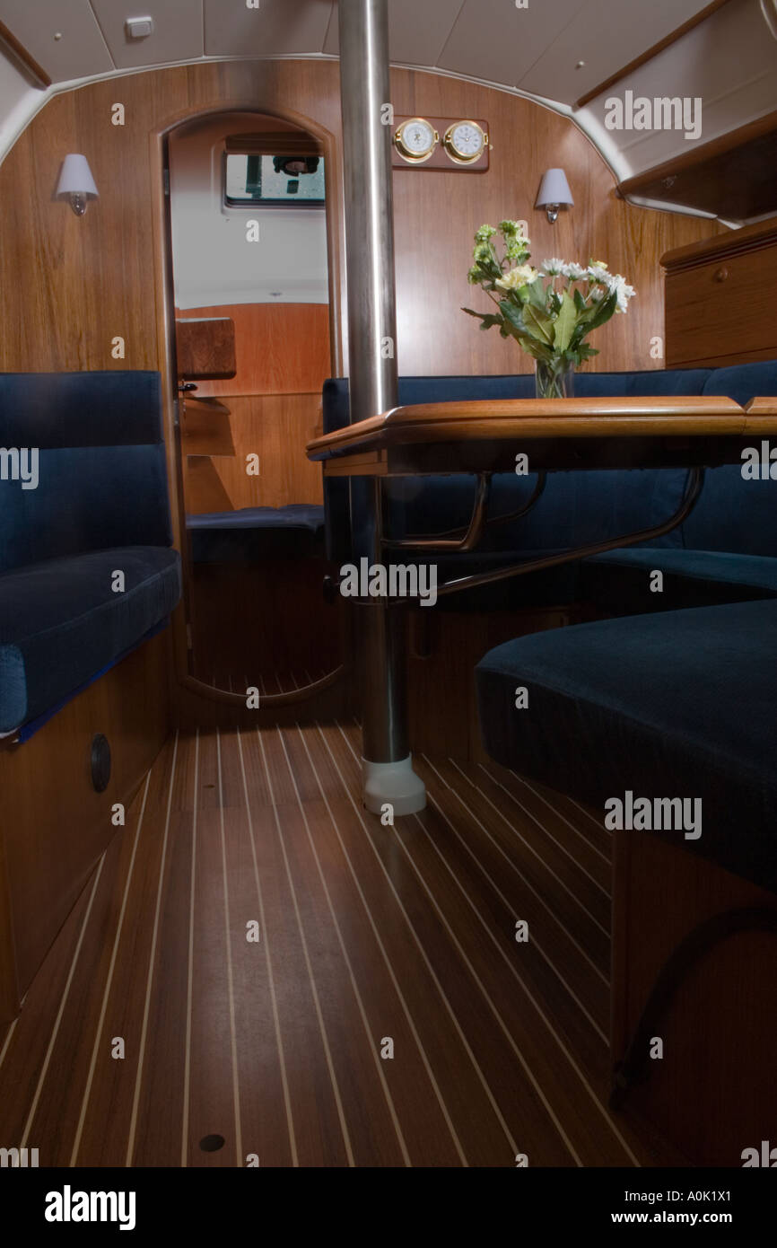 boats interior which is made from wood looking at the table and seating ...