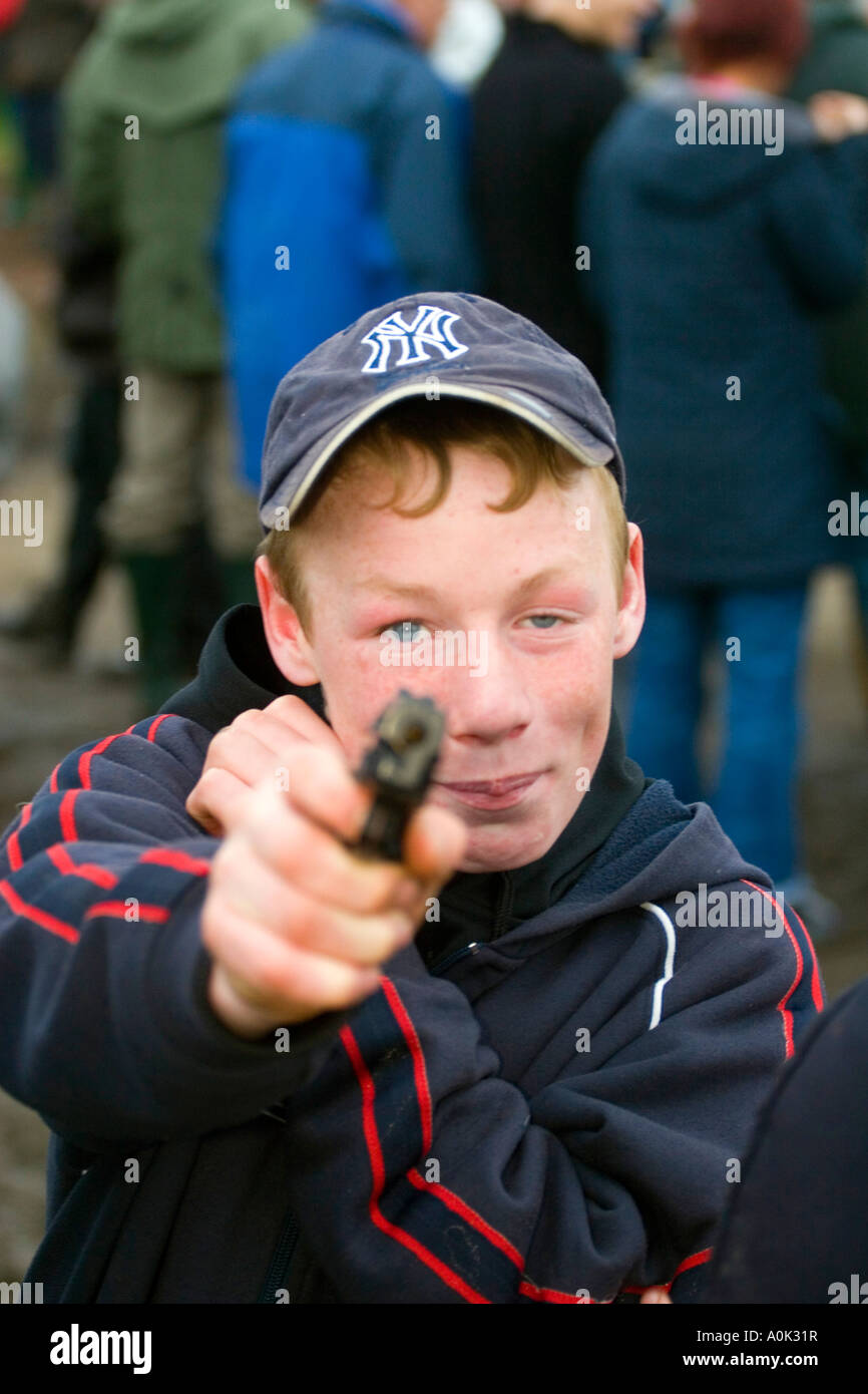 A youth points a fake gun at the camera Stock Photo - Alamy