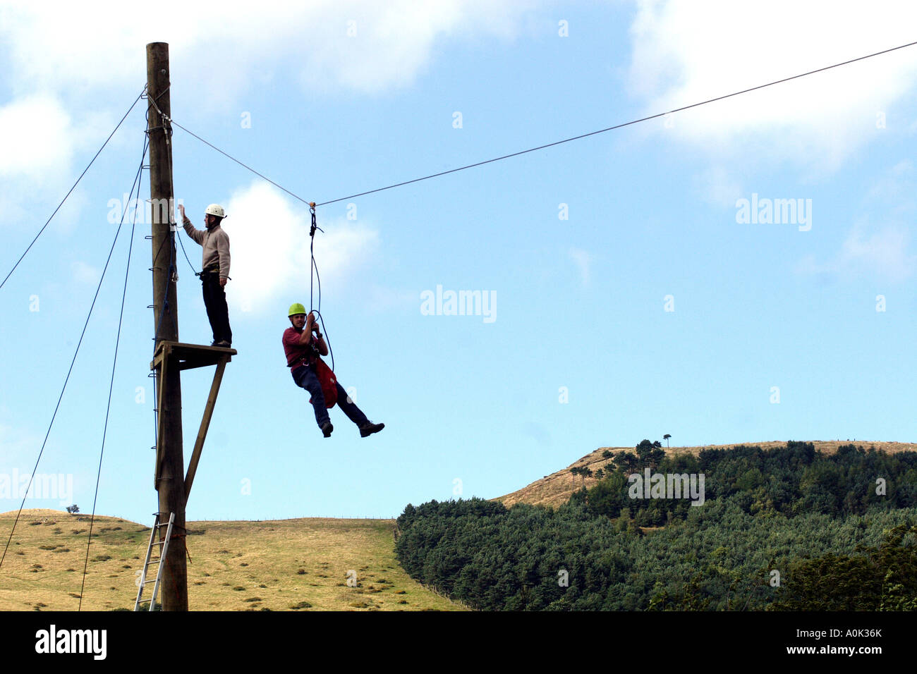 A man on a zip wire in the Peak District National Park, Derbyshire ...