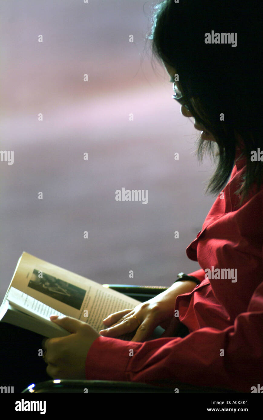 A FEMALE READER READING A BOOK Stock Photo - Alamy
