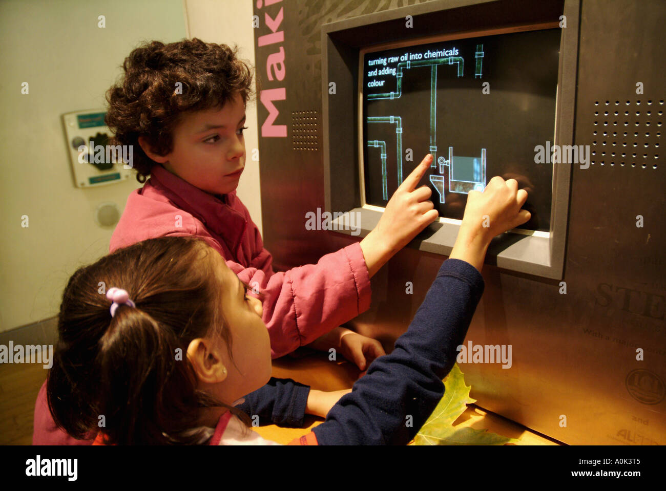 SCHOOL CHILDREN IN LEARNING PROCESS OF COMPUTER Stock Photo - Alamy