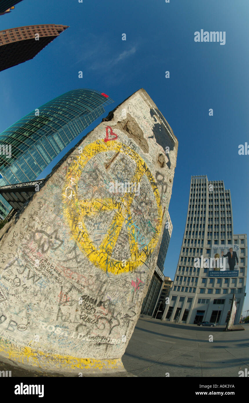 Yellow peace sign painted on a section of original Berlin Wall at the ...