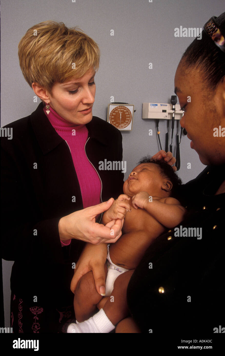 Baby care nurse examines hi-res stock photography and images - Alamy