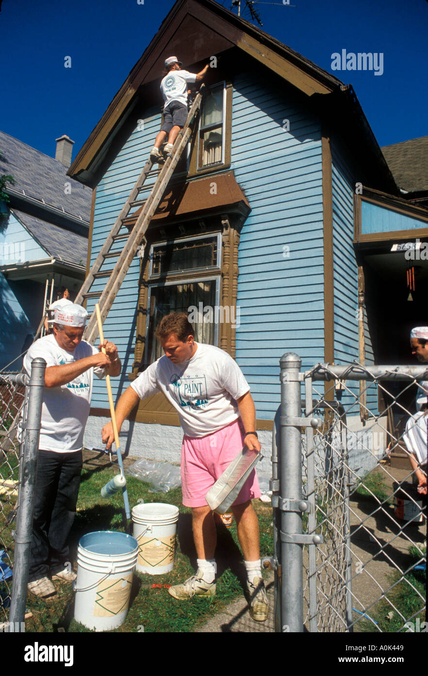 Volunteers paint house for low income Detroit resident Stock Photo - Alamy