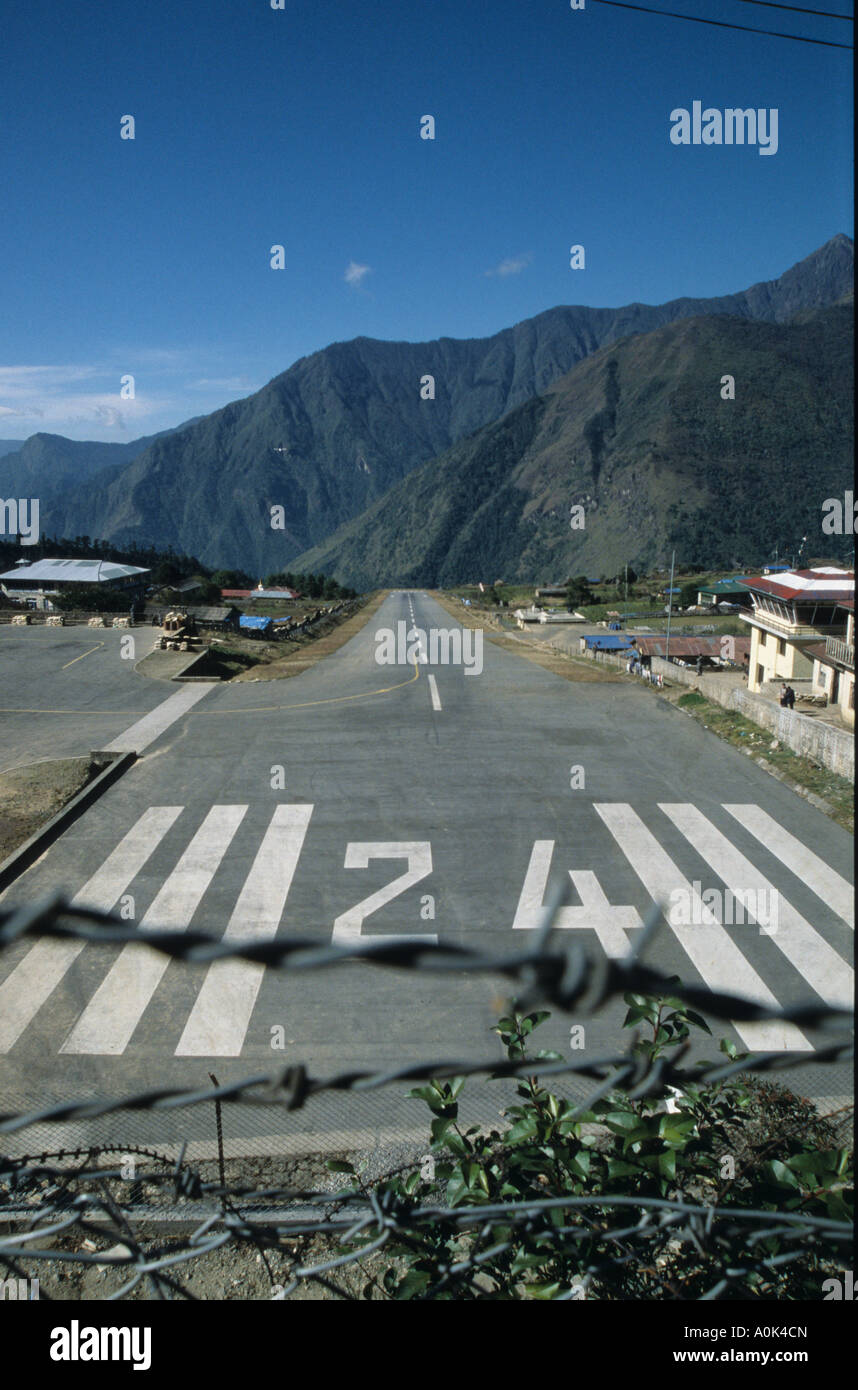 A plane flying off Runway 24 at Lukla airstrip in the Himalayas, Nepal ...