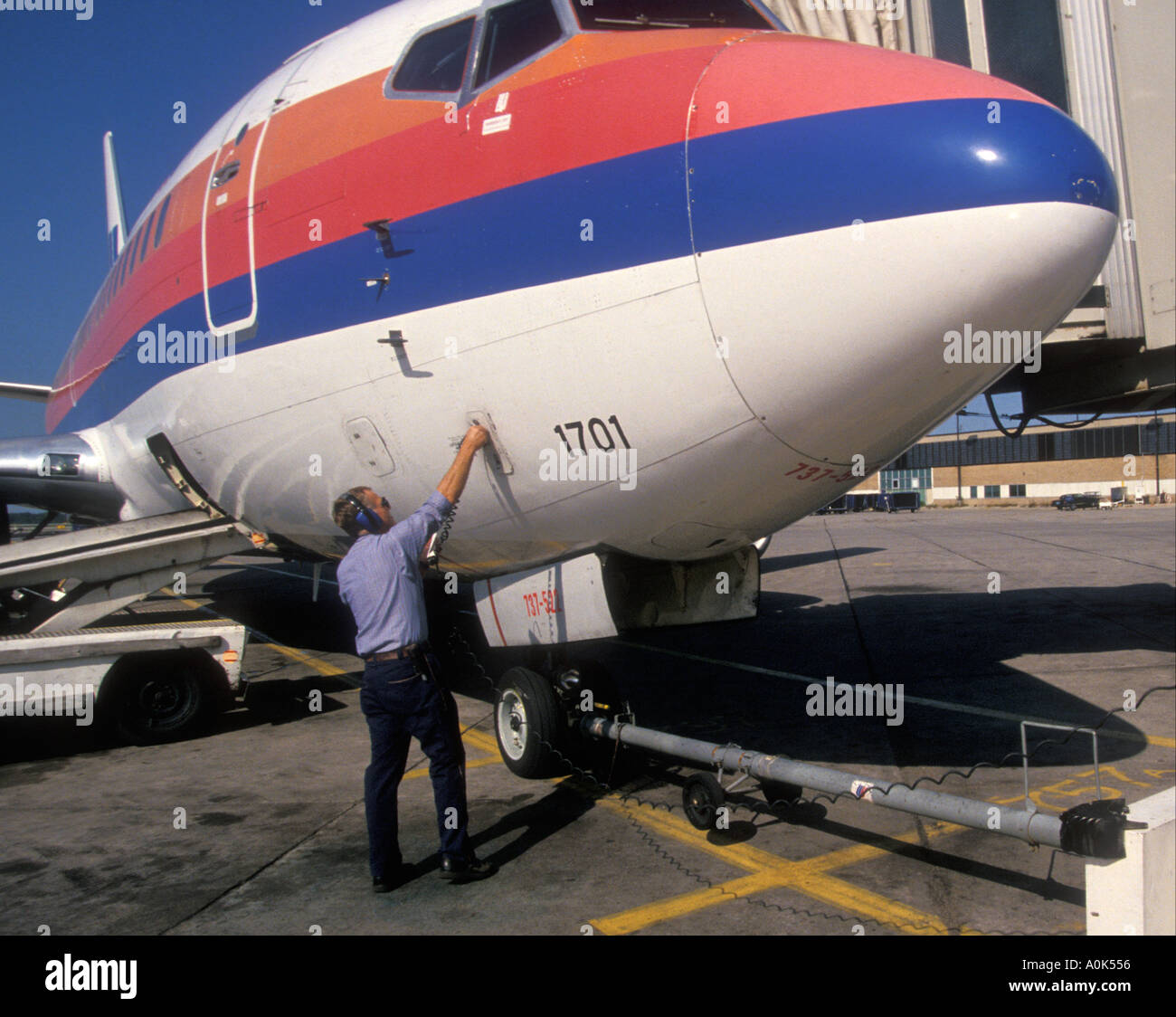 Ground worker meets United Air Lines jet upon arrival at Detroit ...