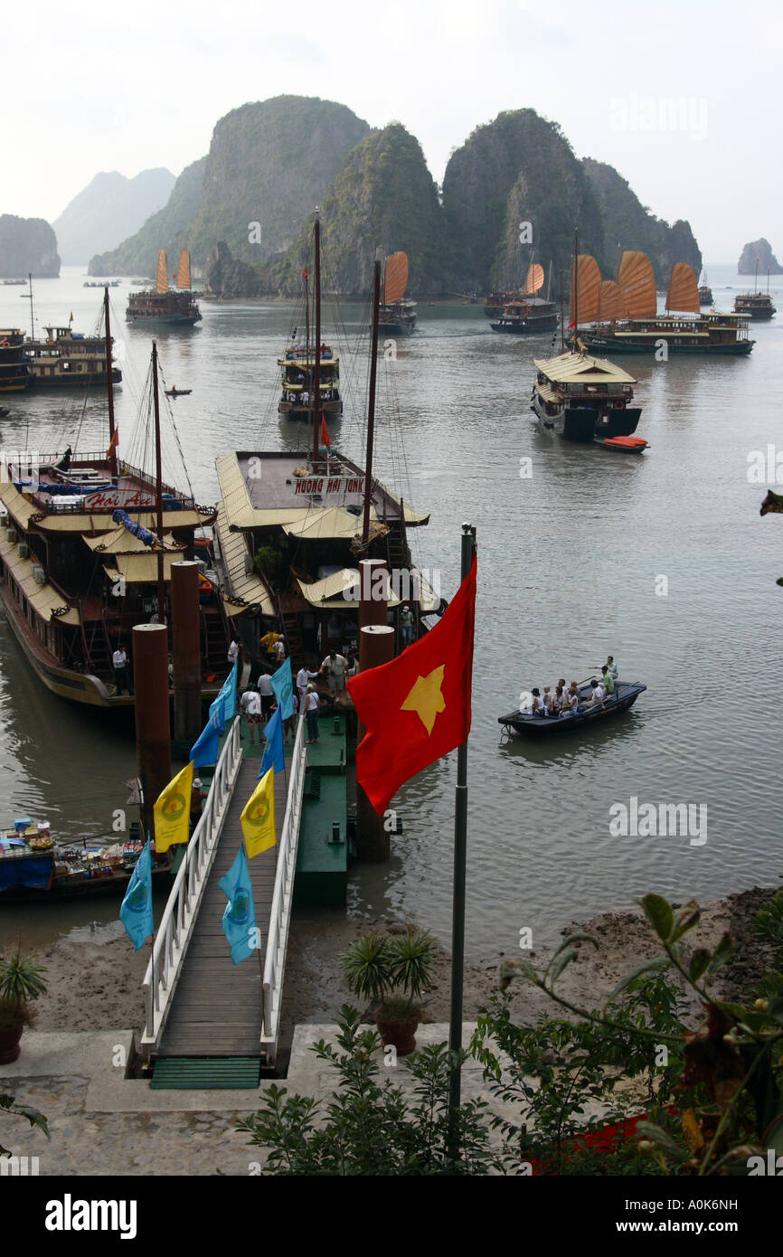 Tourist boats sailing to the landing for Hang Sung Sot cave - the Cave of Surprises in Ha Long ...