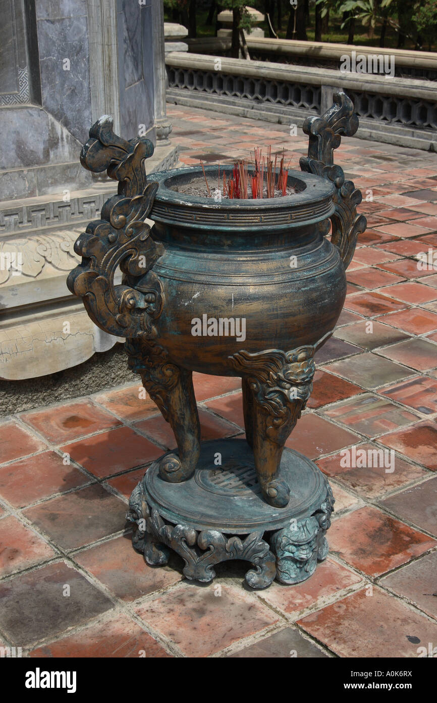 Incense burning in the Buddhist temple grounds by Thien Mu Pagoda on ...
