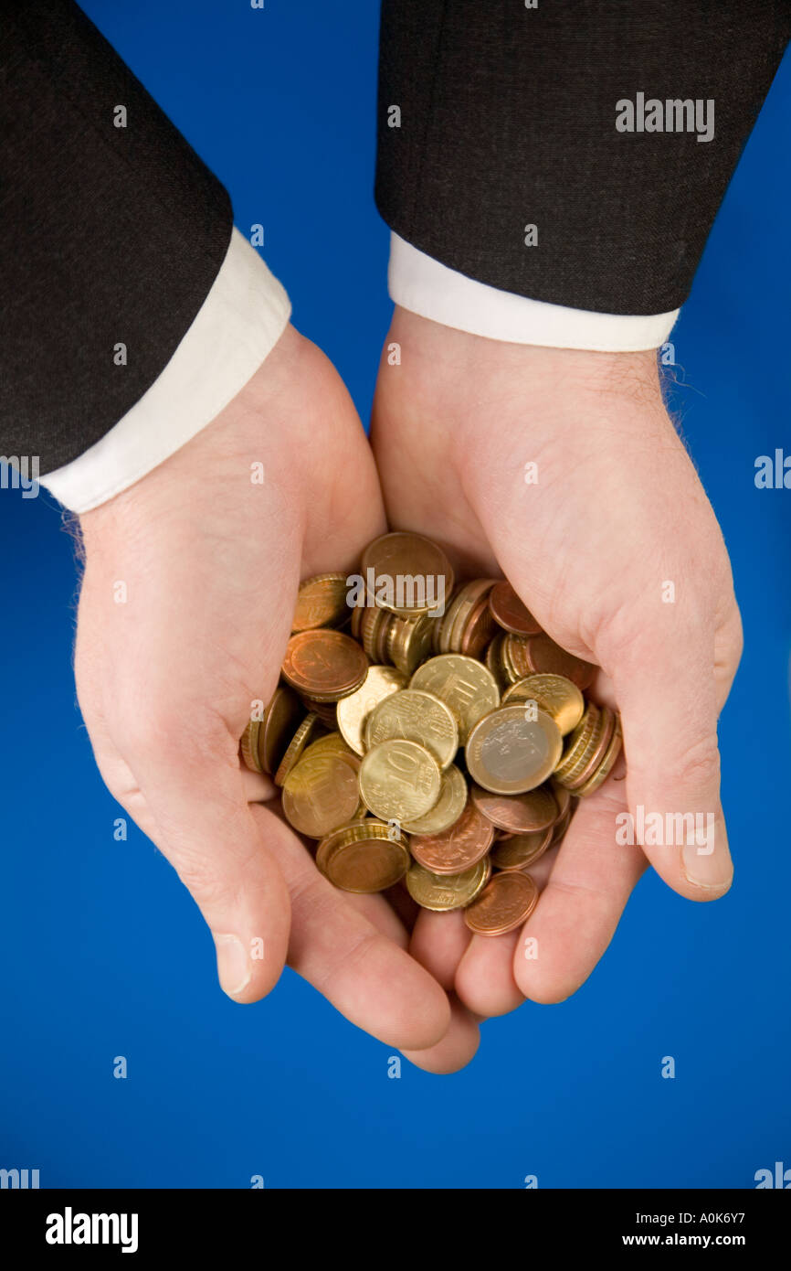 hand full of change Stock Photo - Alamy