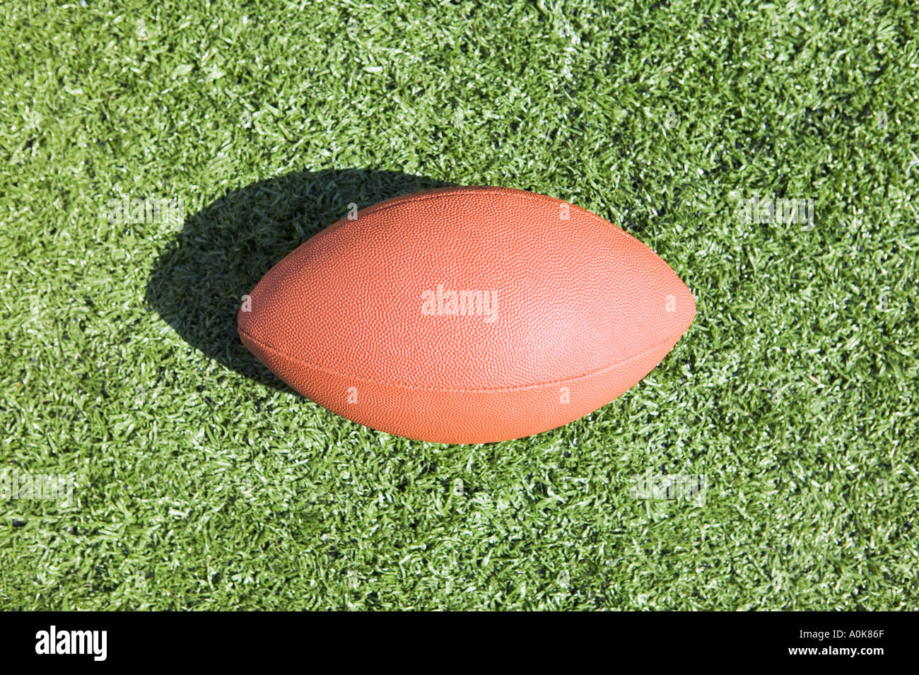 Detail of football on artificial turf field Stock Photo - Alamy