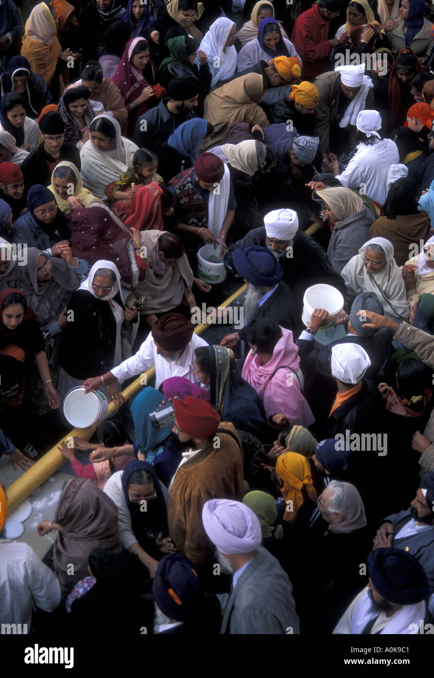 Ritual cleaning of the flagpole with yoghurt at Baisakhi the Sikh new ...