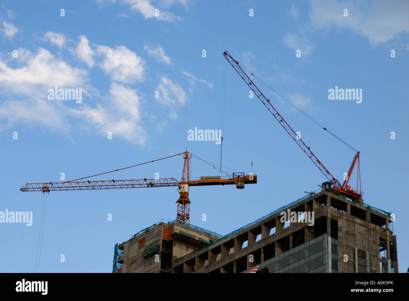 crane on top of building under construction in Kuala Lumpur, Malaysia ...