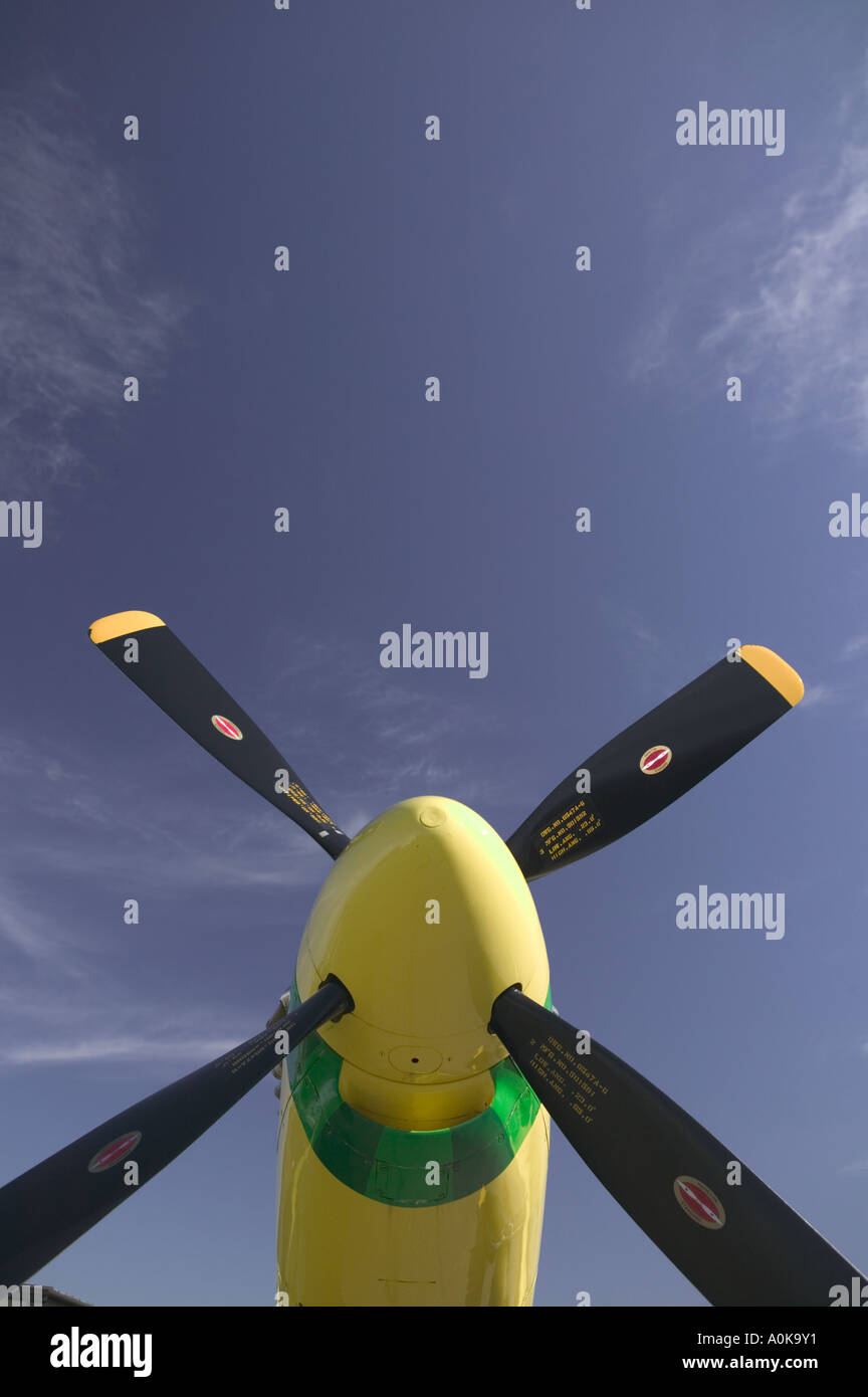 Yellow P-51 Mustang aircraft, looking up at the propeller from below ...